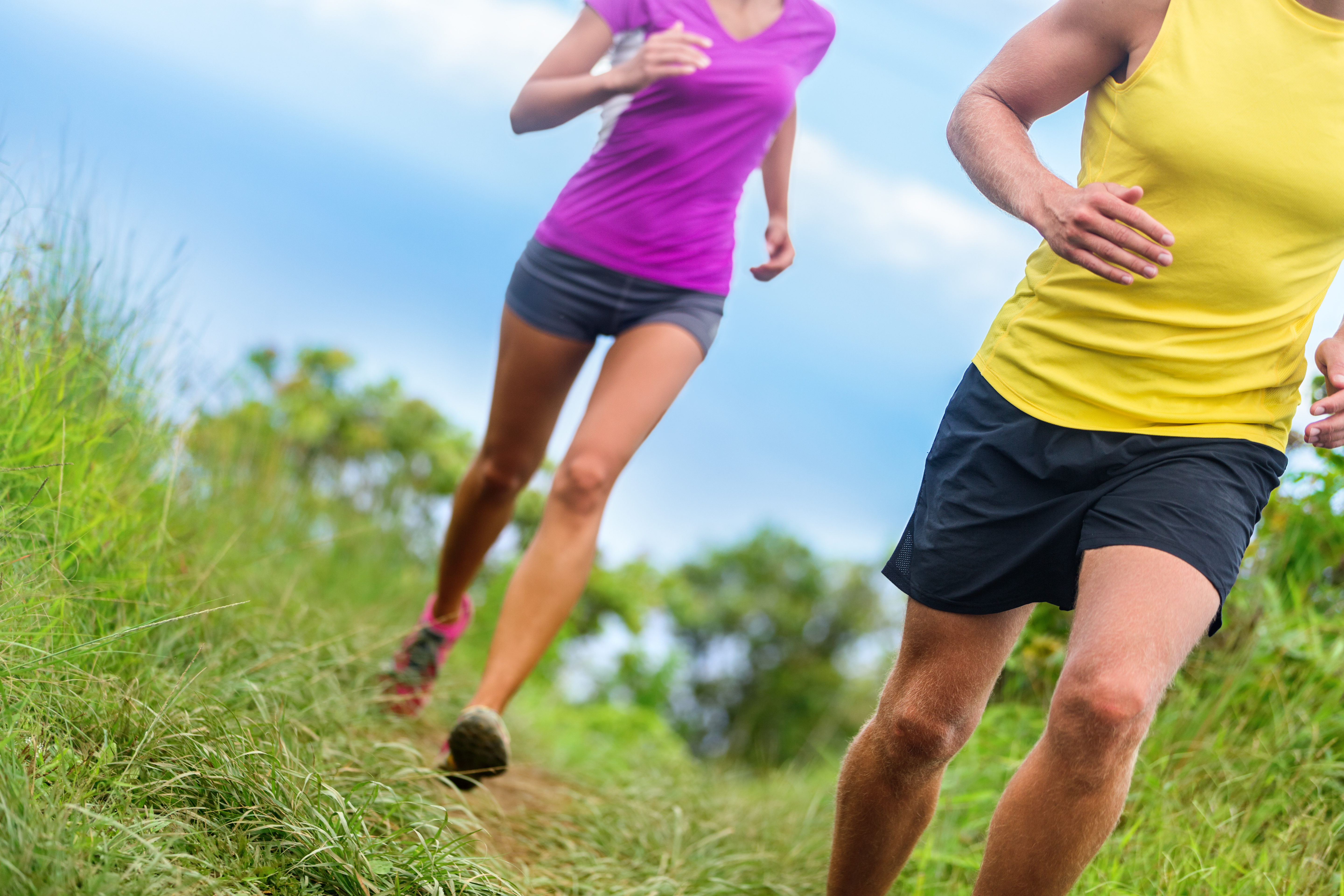 Fitness athletes trail running – athletic legs closeup lower body crop ...
